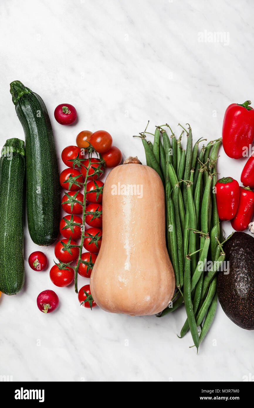 a variety of fresh Vegetables background on a white marble table. place ...