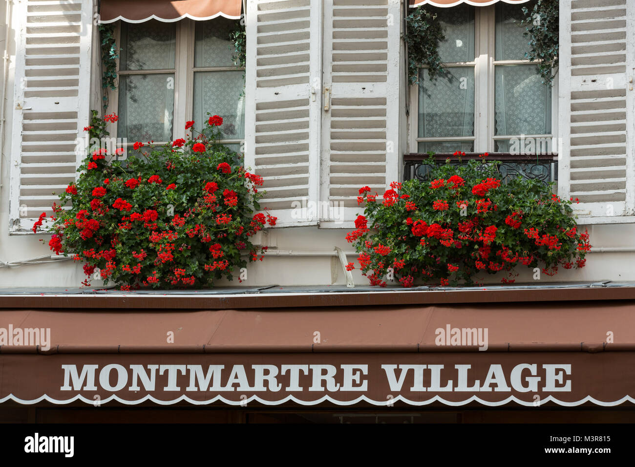 Windows with shutters of old buildings on Montmartre, Paris Stock Photo ...