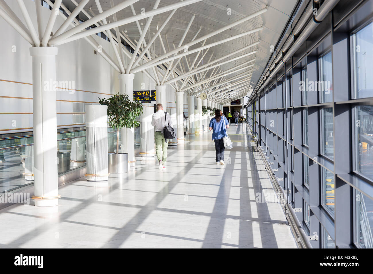 Tourist are walking to different gate by follow the gate label with ...