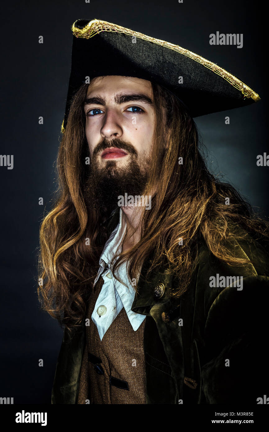 Portrait of a medieval bearded pirate on black background Stock Photo ...