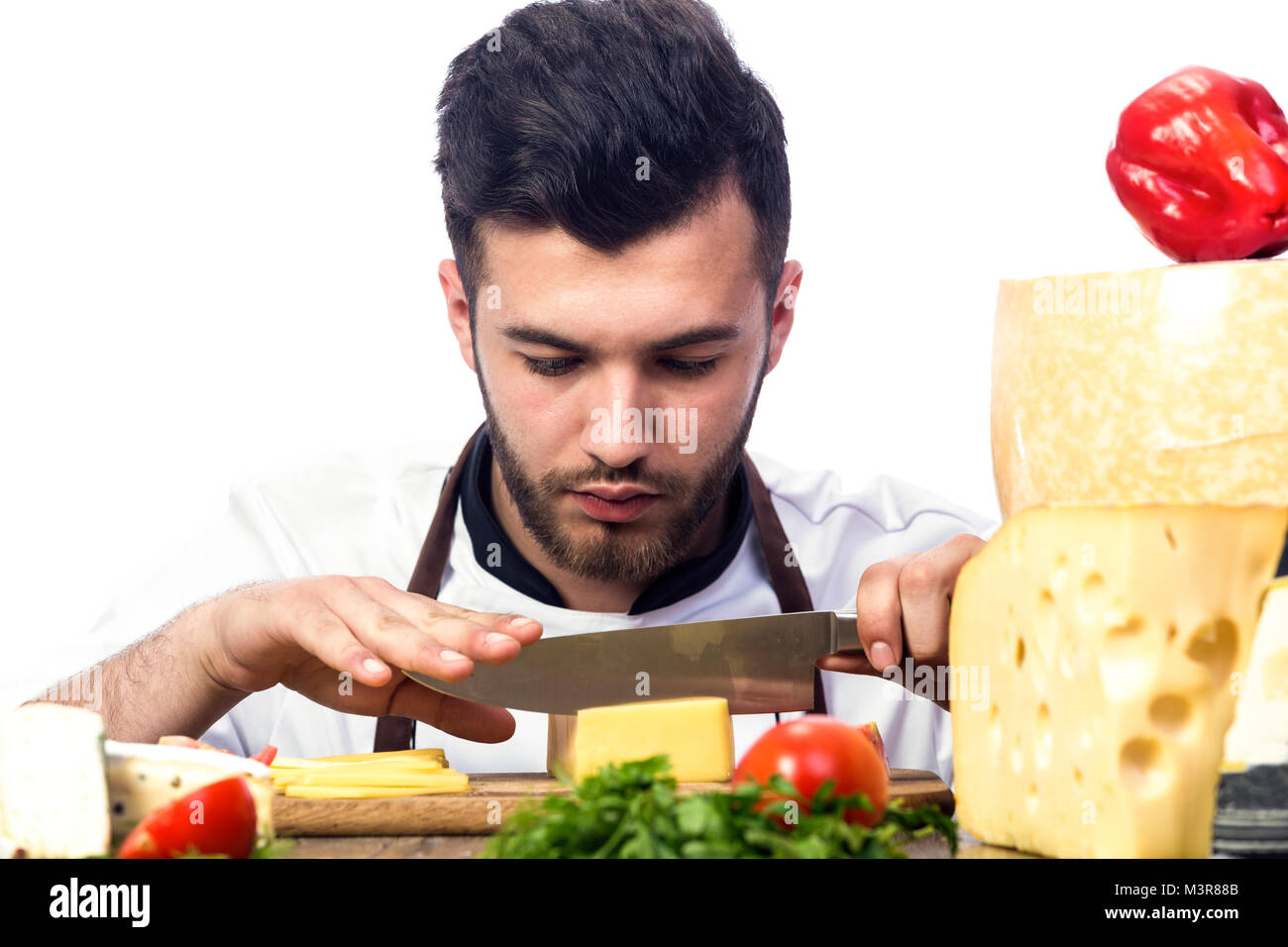 chef isolated on white background, cuts cheese Stock Photo - Alamy