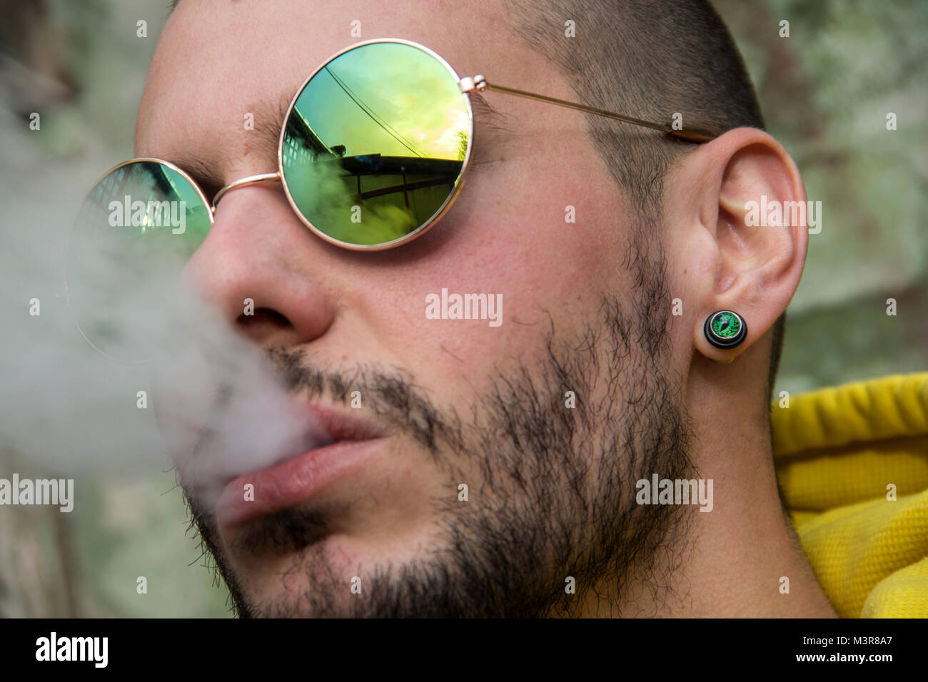 Portrait of a Vaper smoking an electronic cigarette Stock Photo - Alamy