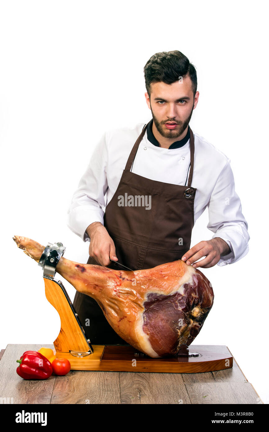 young chef modeling appearance advertises jamon on a white background ...