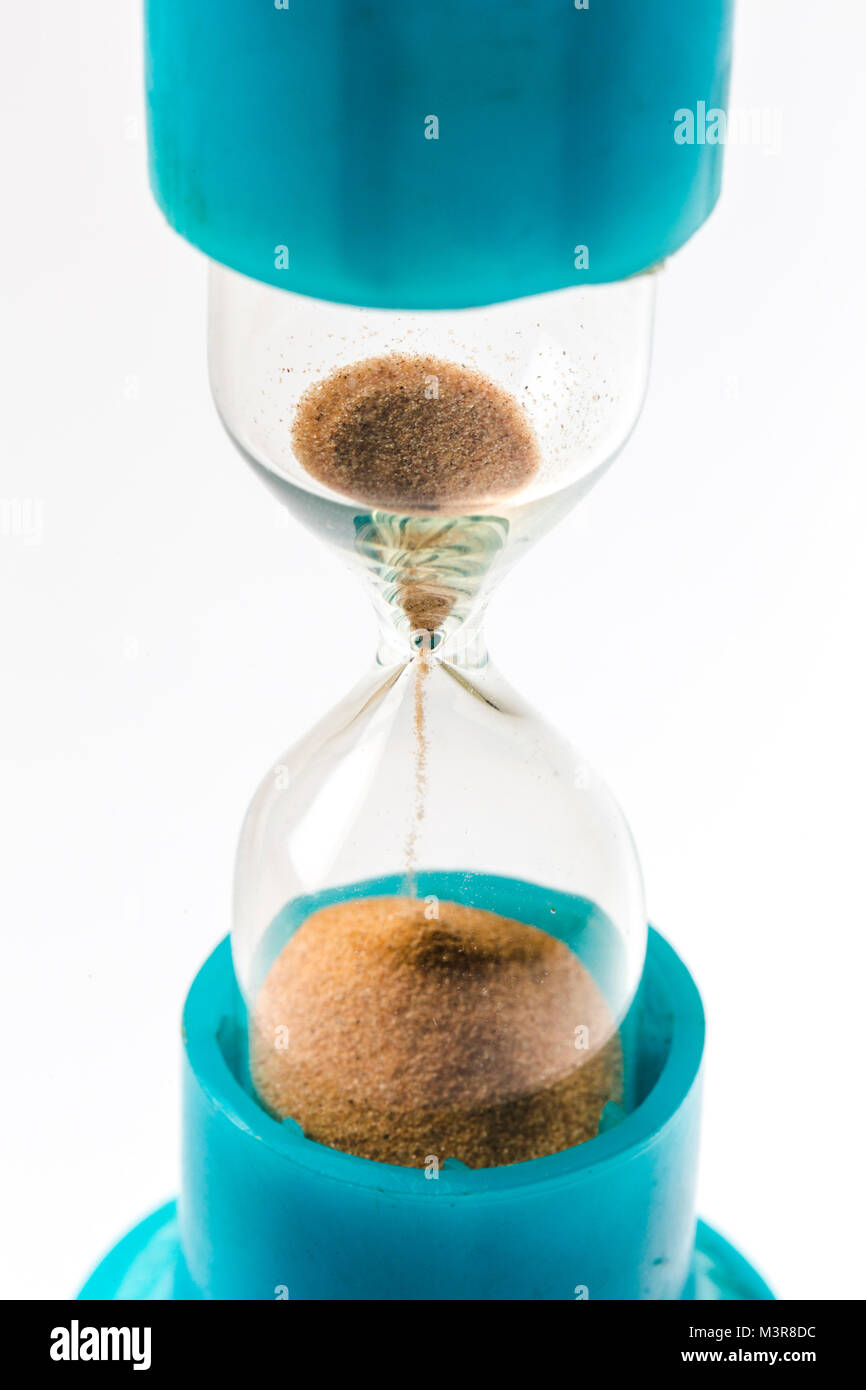 Sand flowing through an hourglass concept for time running out ...