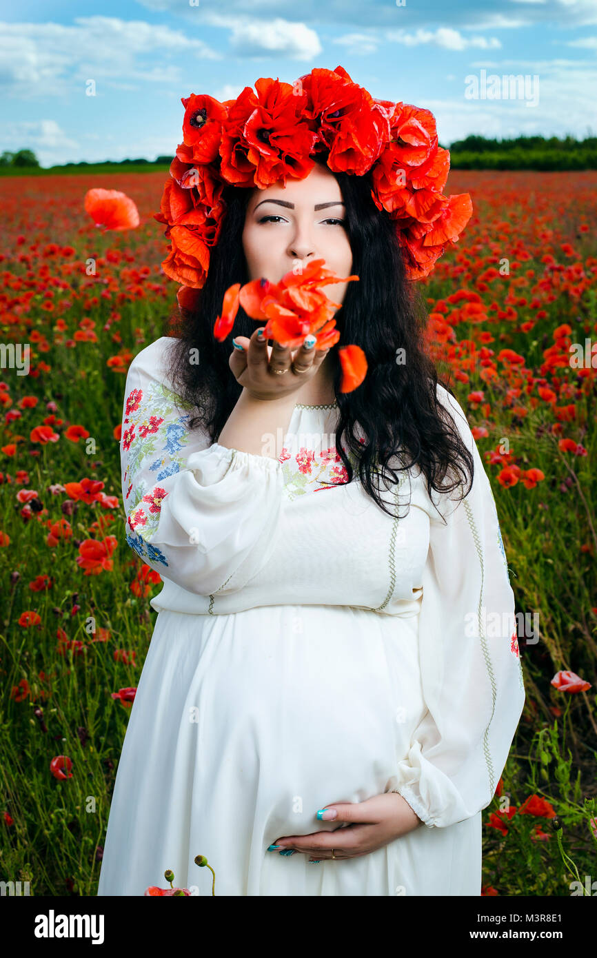 Woman wearing red poppy hi-res stock photography and images - Alamy