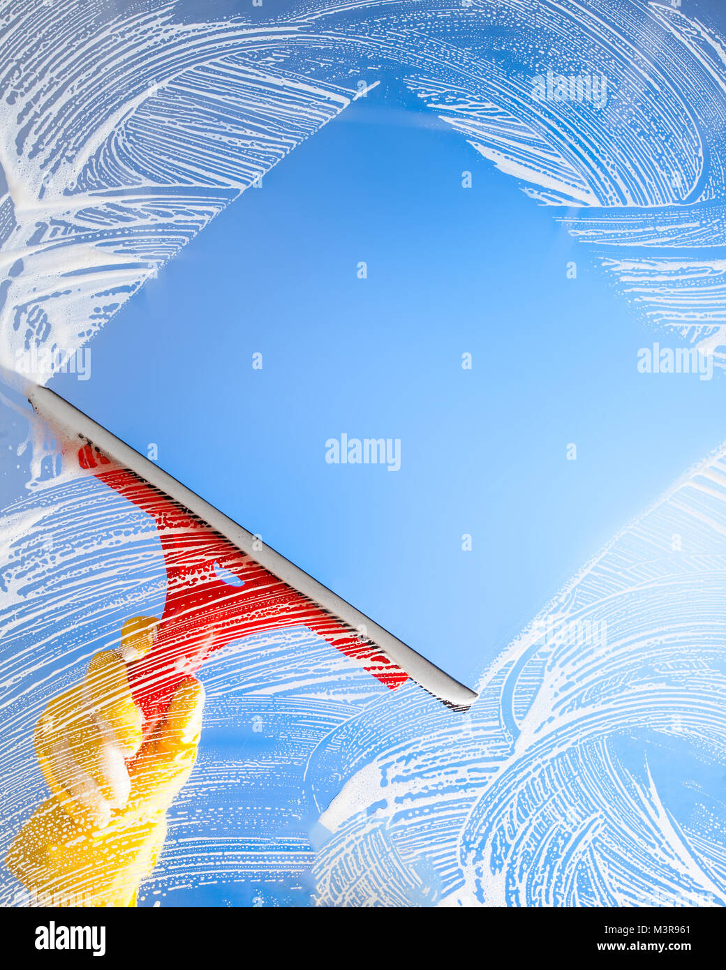 cleaning window with squeegee blue sky Stock Photo - Alamy