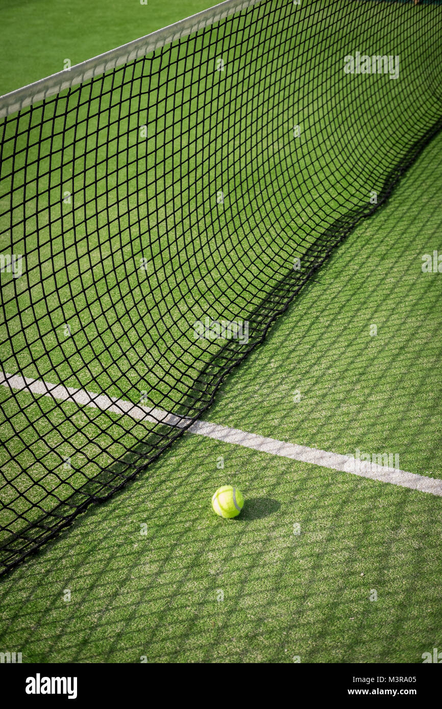 Paddle tennis court and net with a ball Stock Photo - Alamy