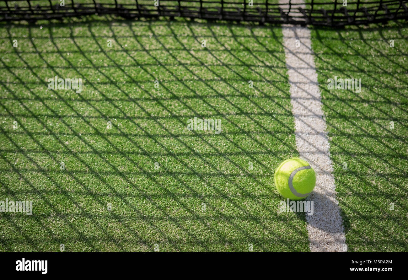 Paddle tennis court and net with a ball Stock Photo - Alamy