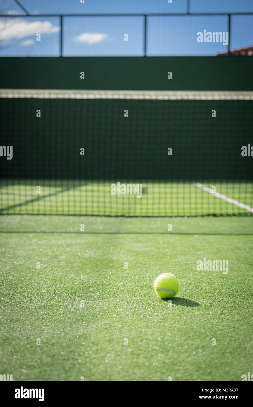 Paddle tennis court and net with a ball Stock Photo - Alamy