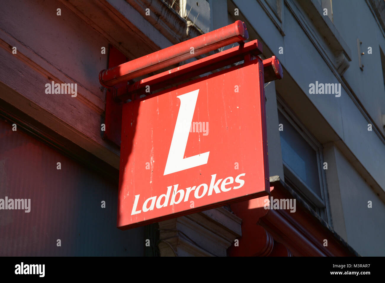 Ladbokes bookmakers sign Stock Photo - Alamy
