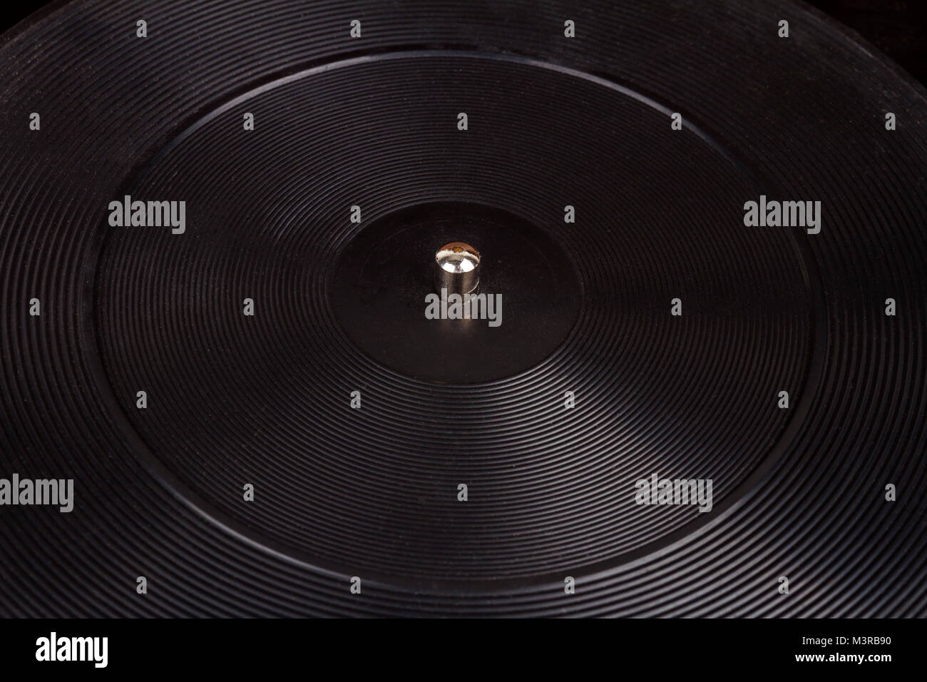 Close up shot of old turntable rubber platter with the spindle Stock ...