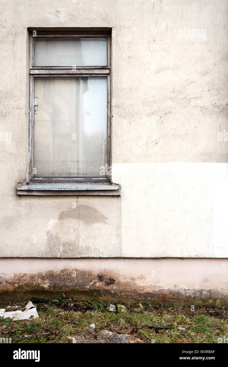 Gray plaster wall with a window. Architecture detail background Stock ...