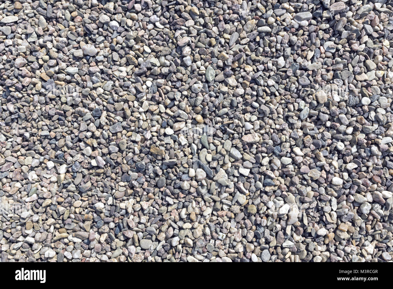 small round pebbles as bright background Stock Photo - Alamy
