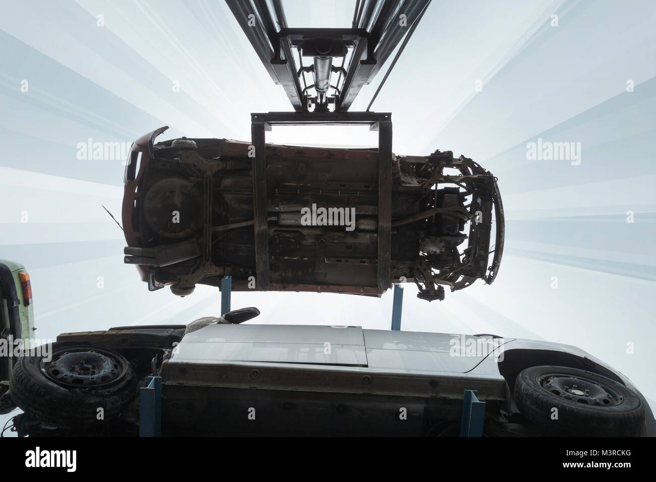 forklift hoisting car wrecks at the junkyard Stock Photo - Alamy