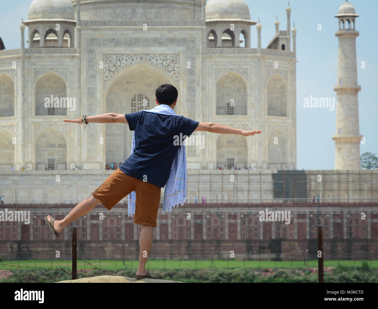 A young man looking at Taj Mahal in Agra, India Stock Photo - Alamy