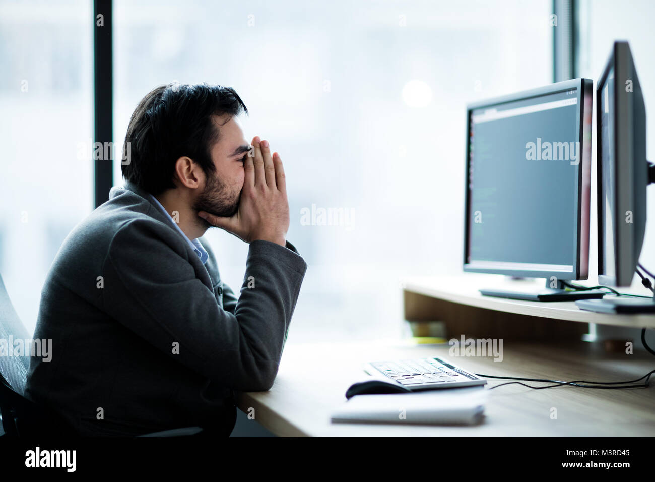 Picture of worried businessman working in office Stock Photo - Alamy