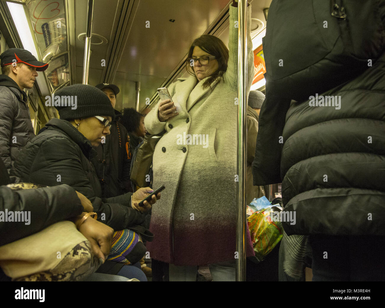 People riding a New York City subway train in New York City Stock Photo ...