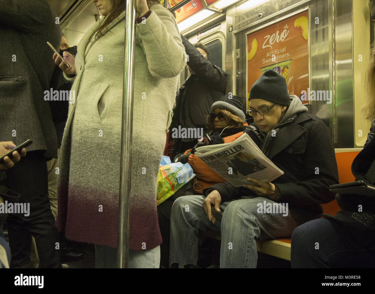 People riding a New York City subway train in New York City Stock Photo ...