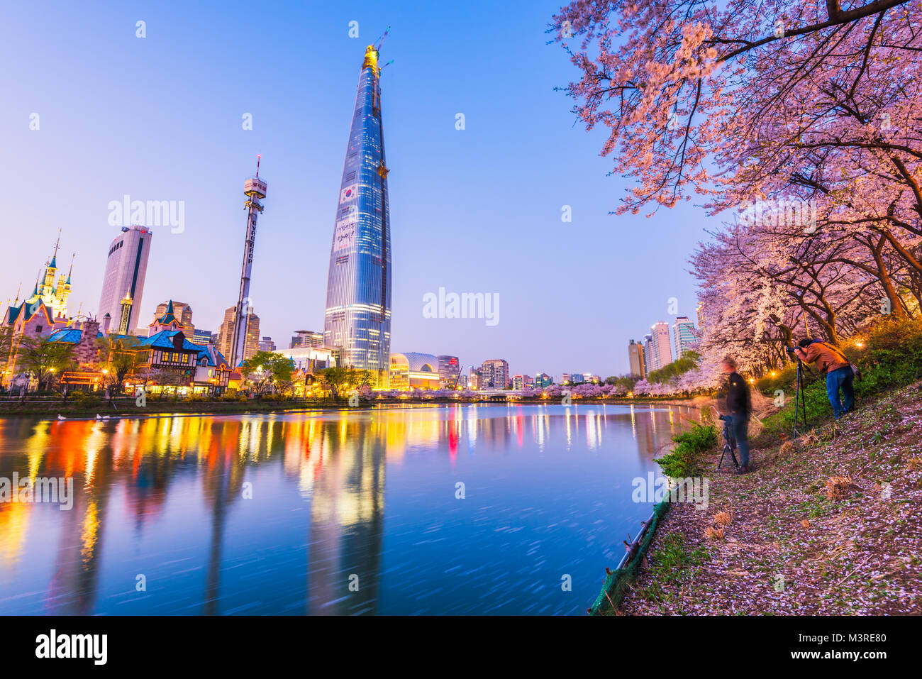 SEOUL, KOREA - APRIL 7, 2016: Lotte World Seokchon Lake park at night ...