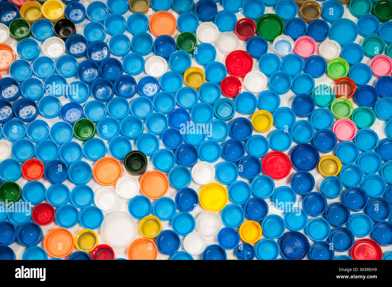 Different color plastic caps from bottles Stock Photo - Alamy