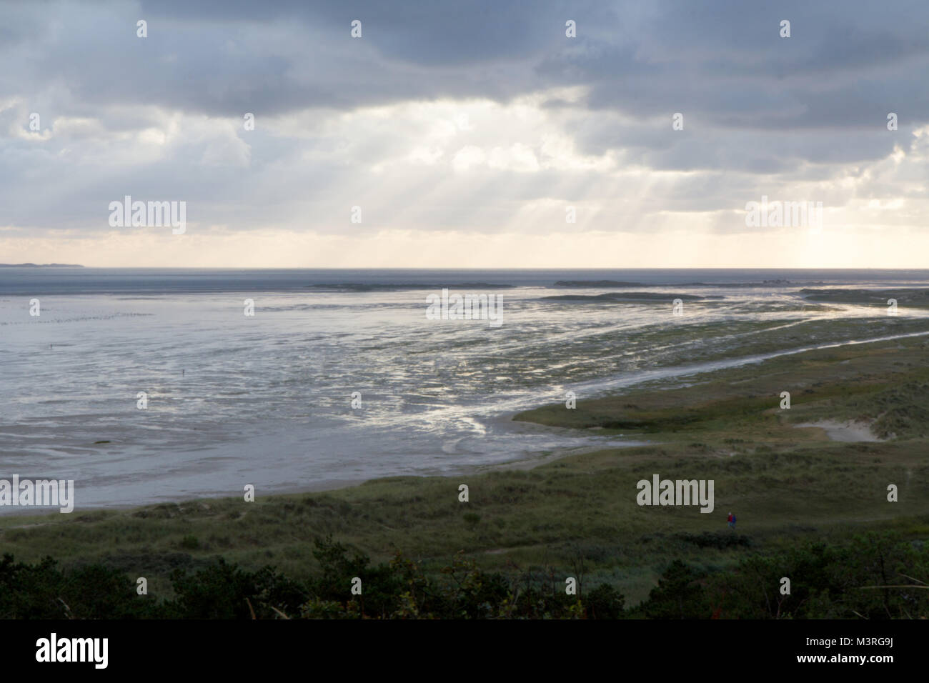 Sun and rain on the beach Stock Photo - Alamy