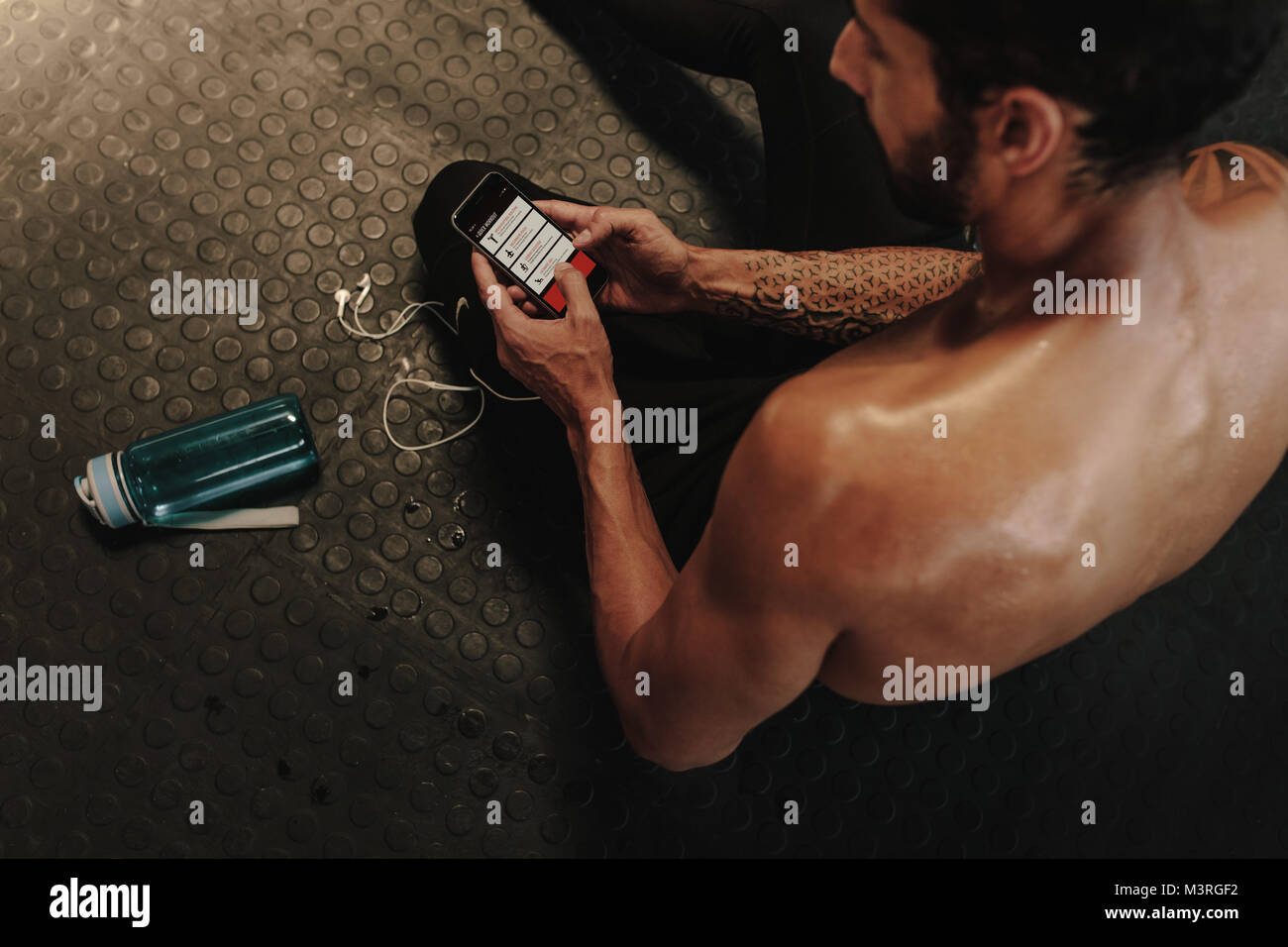 Male athlete using app on hi-res stock photography and images - Alamy