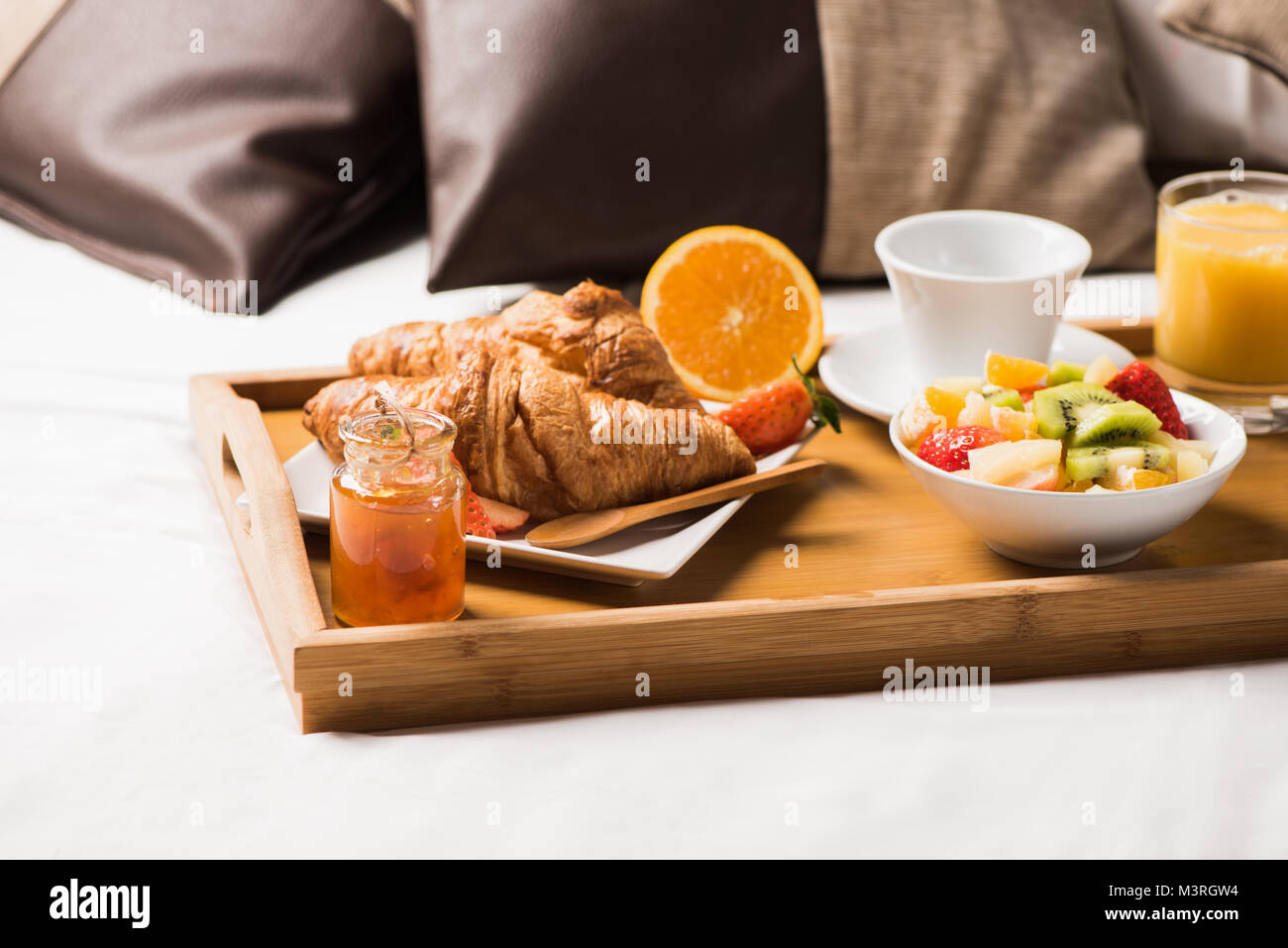Tray with breakfast food on the bed inside a bedroom Stock Photo - Alamy