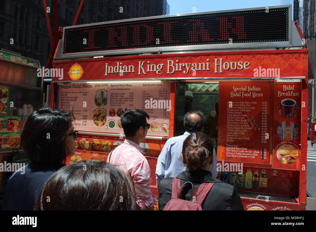 office workers queue on line at lunchtime indian king biryani house ...