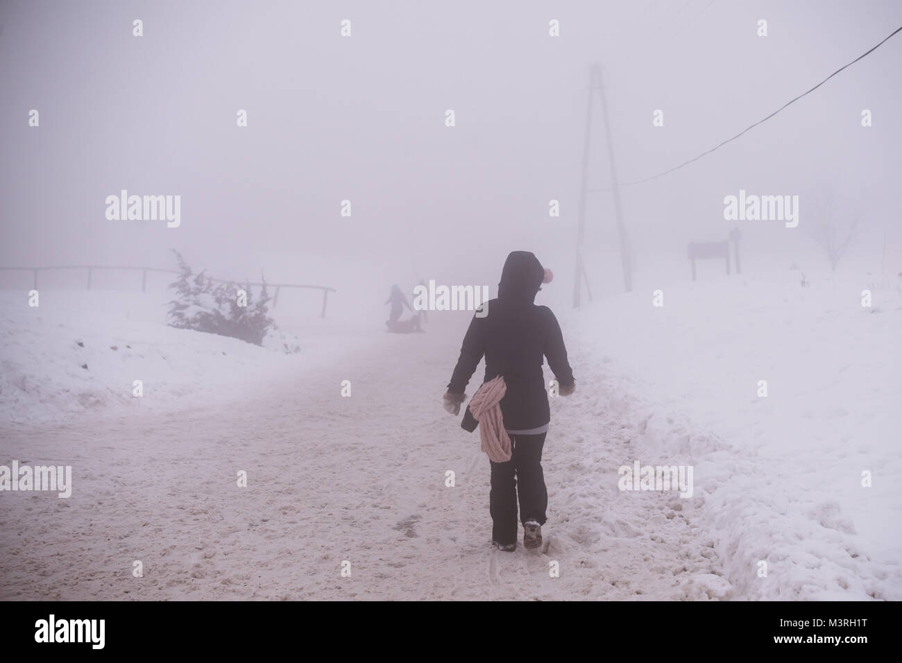 Woman windy snow flurry hi-res stock photography and images - Alamy