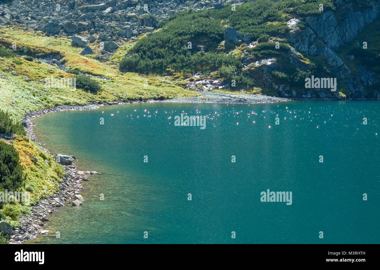 Polish Tatry Tatra, crystal clear water lake / pond in the mountain ...