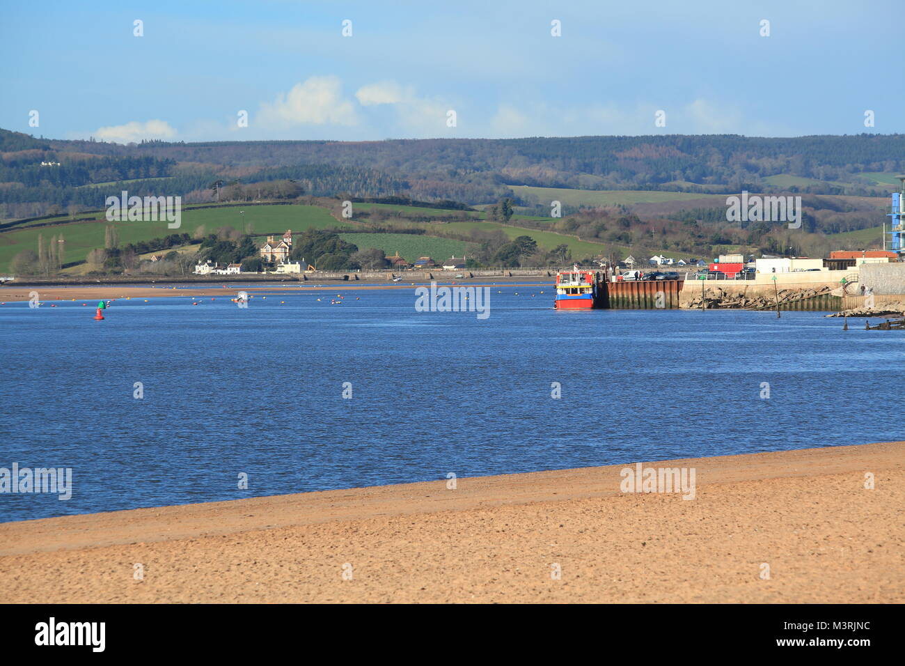 View from Exmouth beach across Exe Estuary to Cockwood, Devon, England ...