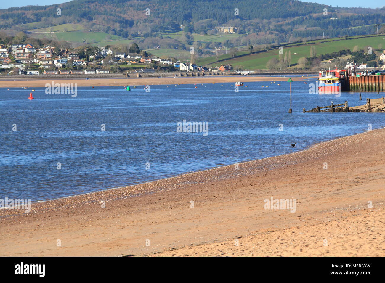 View from Exmouth beach across Exe Estuary to Cockwood, Devon, England ...