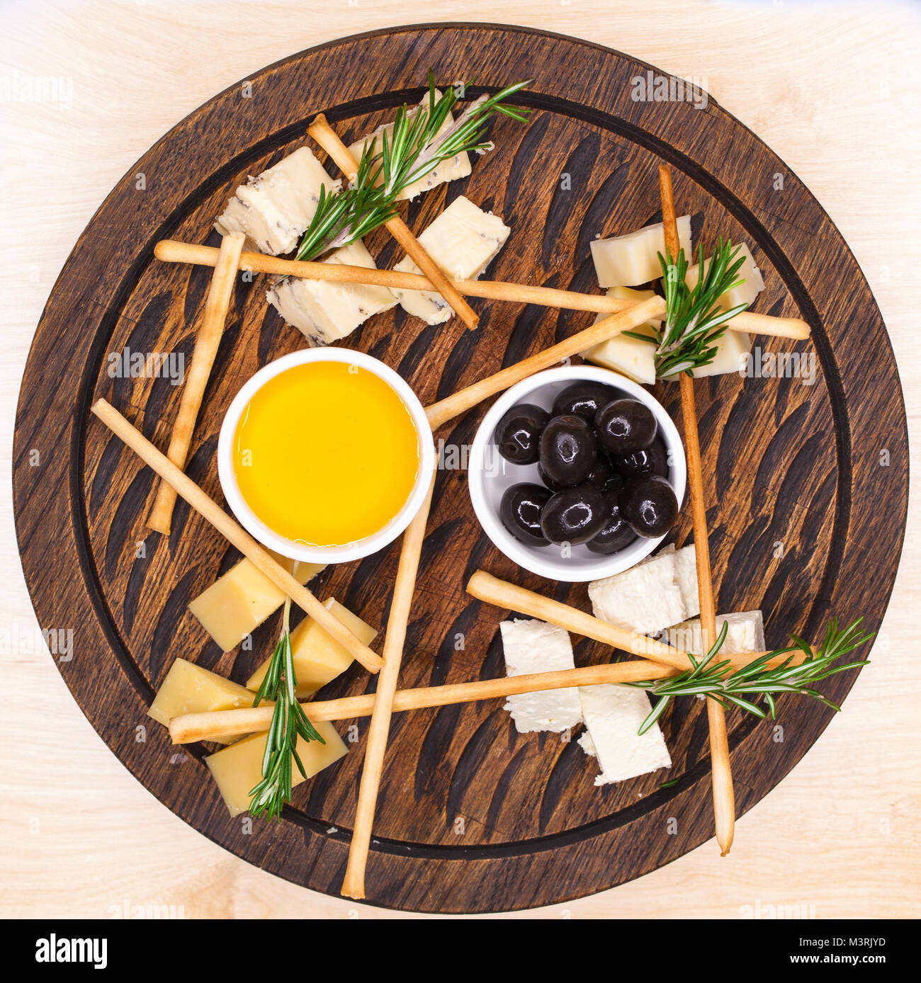 Restaurant dish - cheese sliced from different types of cheese with ...