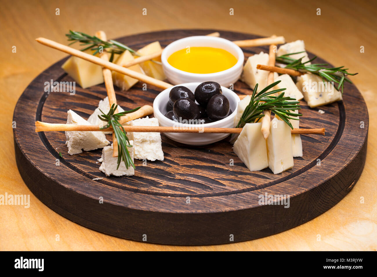 Restaurant dish - cheese sliced from different types of cheese with ...