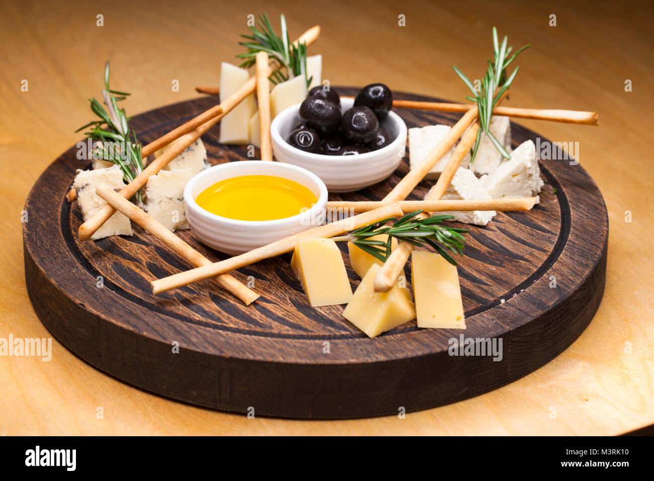 Restaurant dish - cheese sliced from different types of cheese with ...