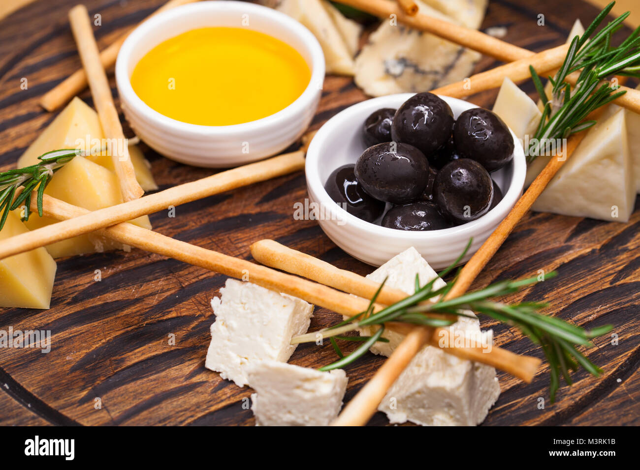 Restaurant dish - cheese sliced from different types of cheese with ...