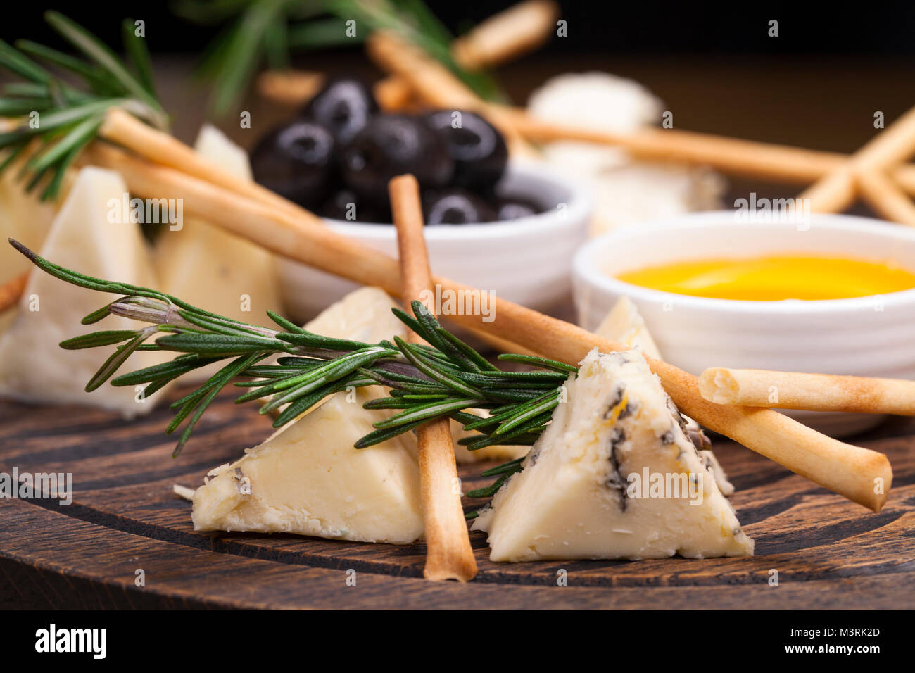 Restaurant dish - cheese sliced from different types of cheese with ...