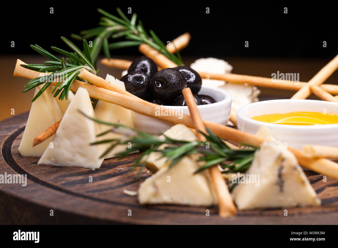 Restaurant dish - cheese sliced from different types of cheese with ...