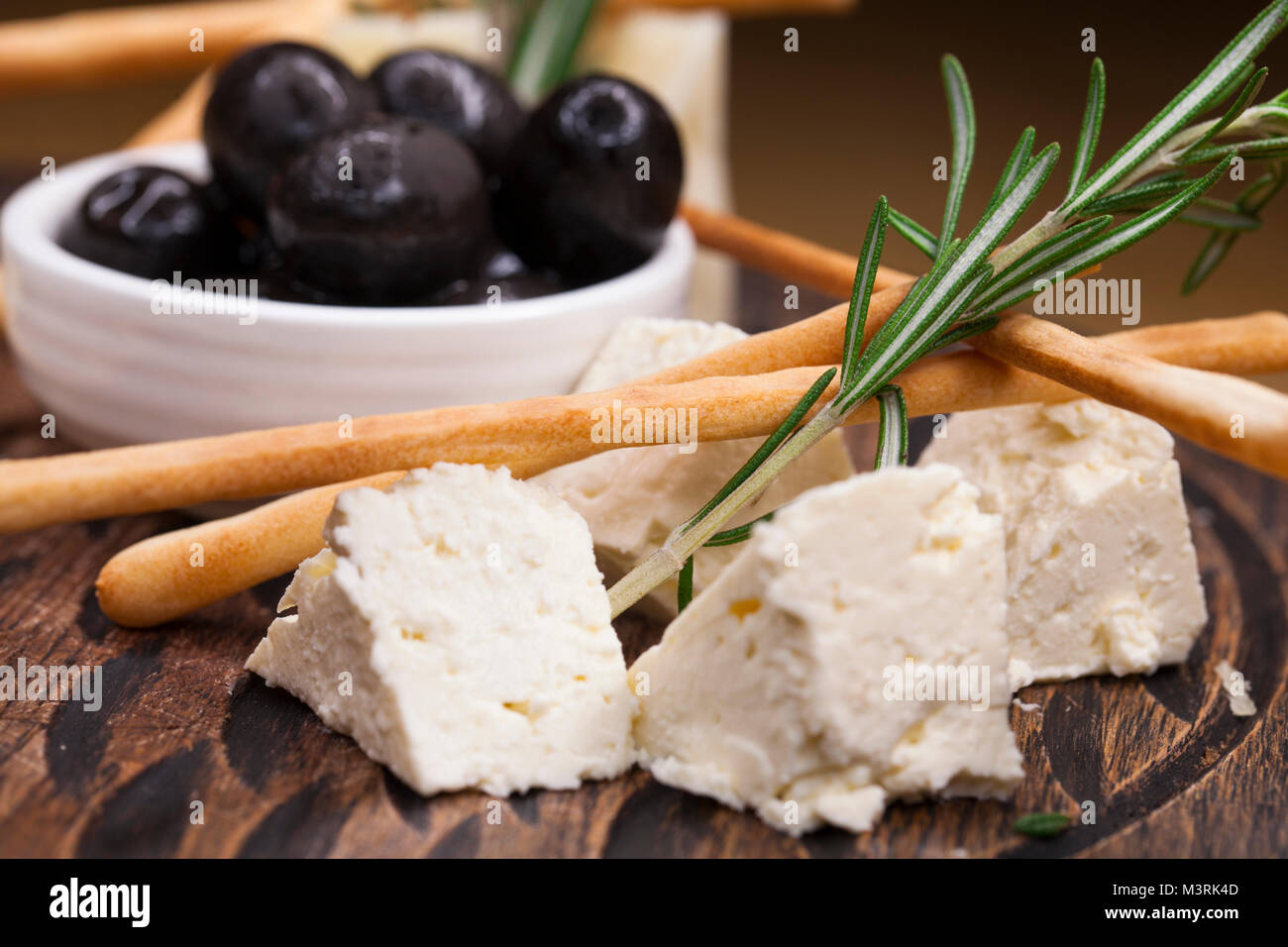 Restaurant dish - cheese sliced from different types of cheese with ...