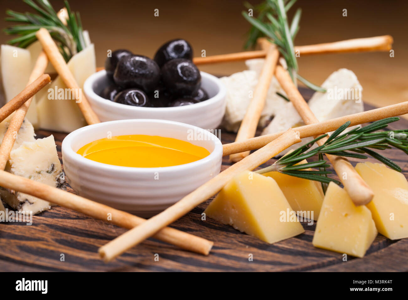 Restaurant dish - cheese sliced from different types of cheese with ...