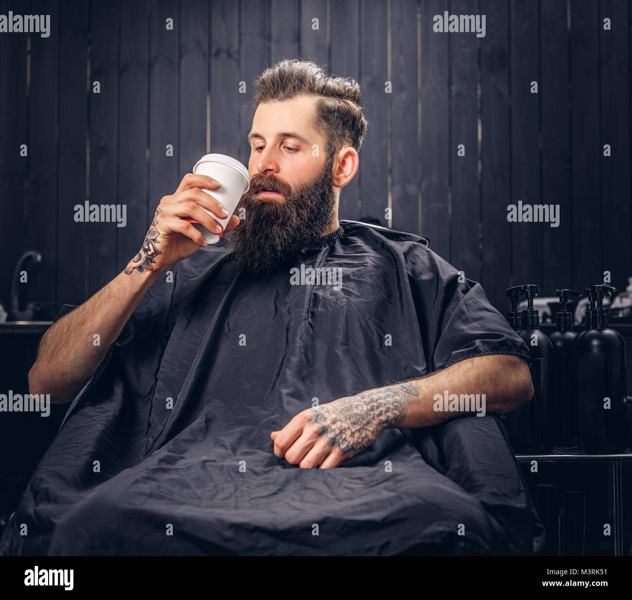 Handsome bearded man in the barbershop Stock Photo - Alamy