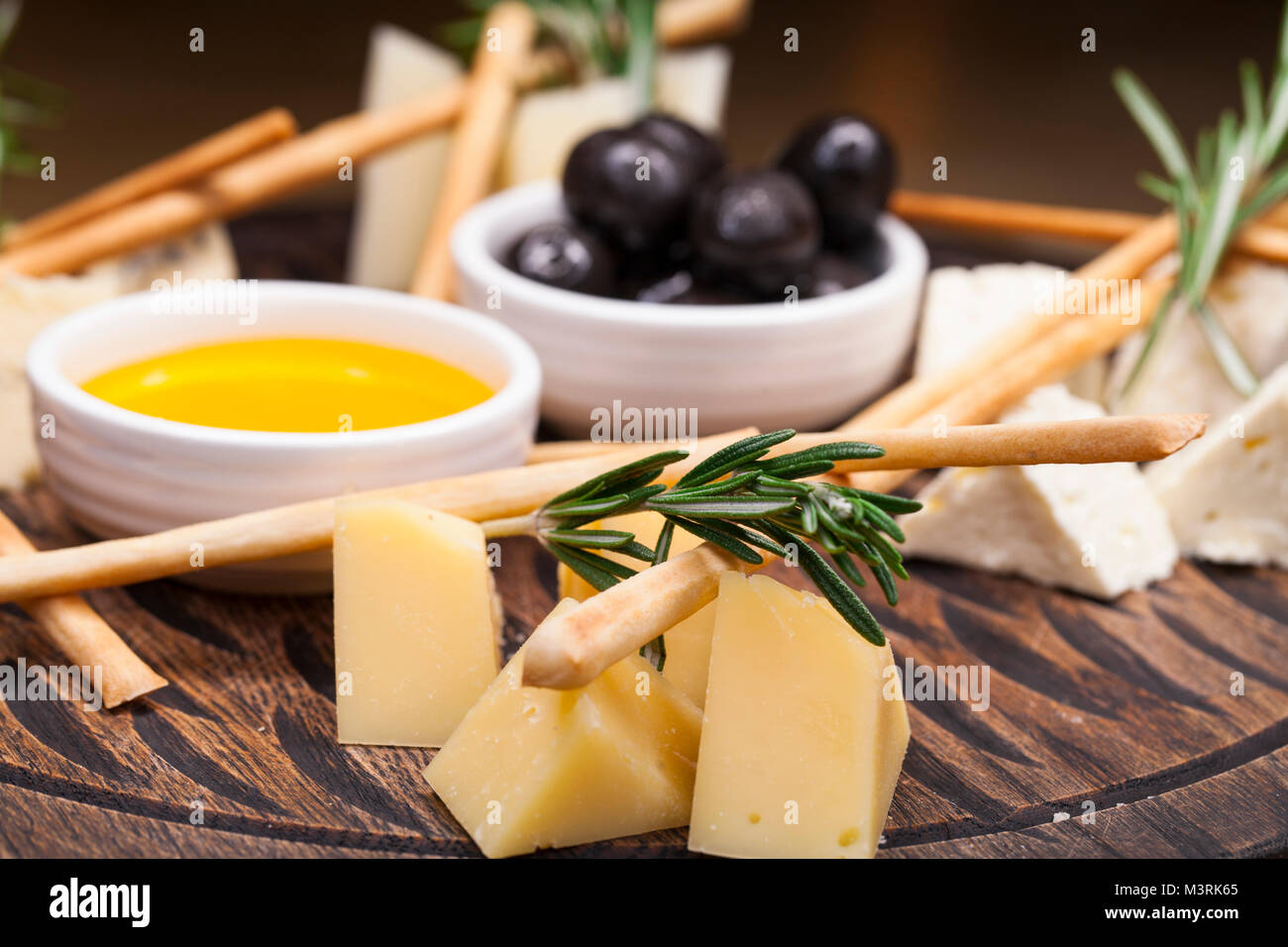 Restaurant dish - cheese sliced from different types of cheese with ...