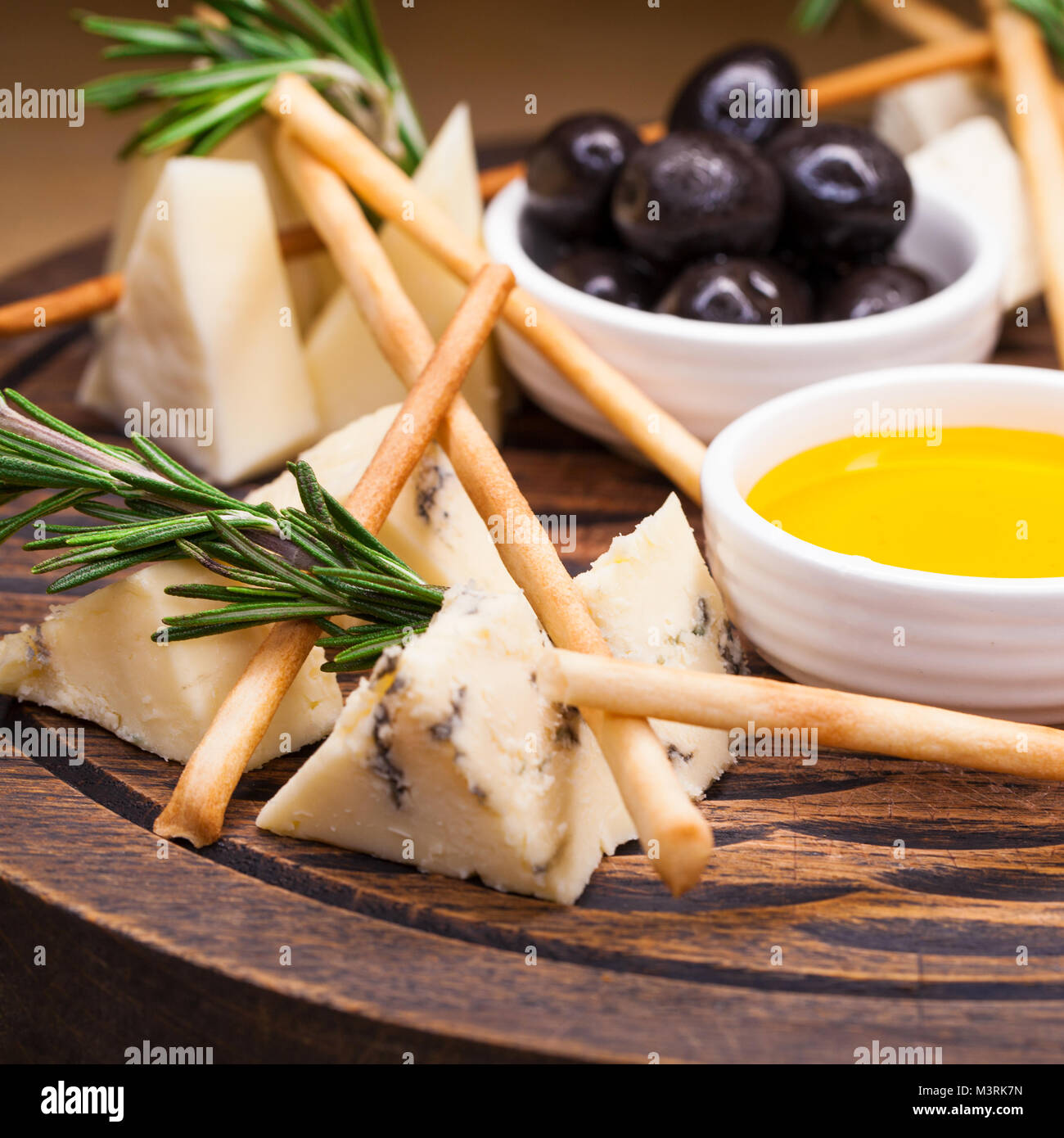 Restaurant dish - cheese sliced from different types of cheese with ...