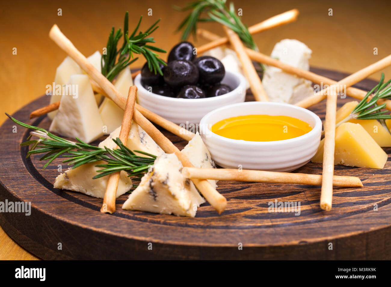 Restaurant dish - cheese sliced from different types of cheese with ...