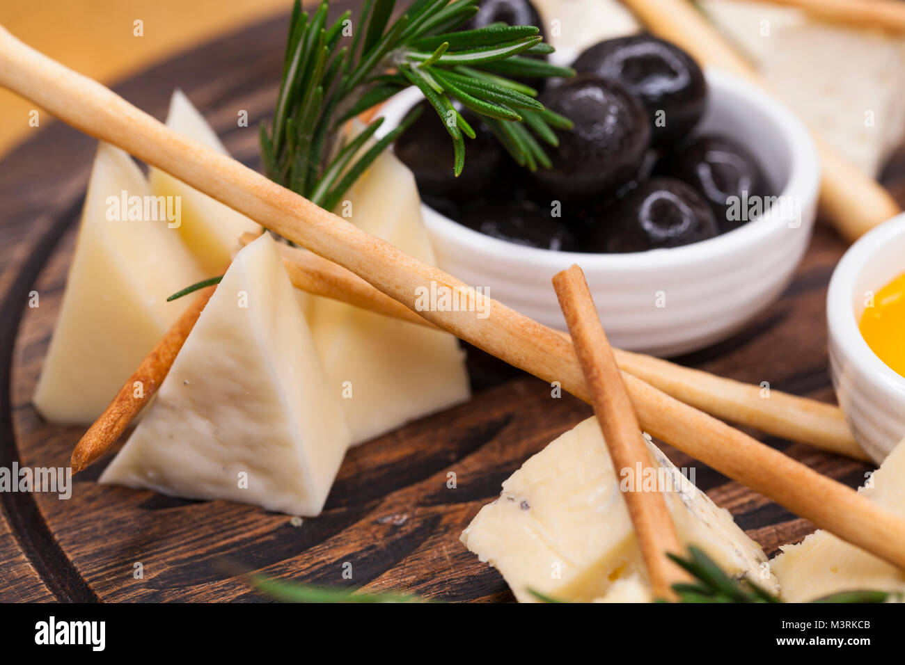 Restaurant dish - cheese sliced from different types of cheese with ...