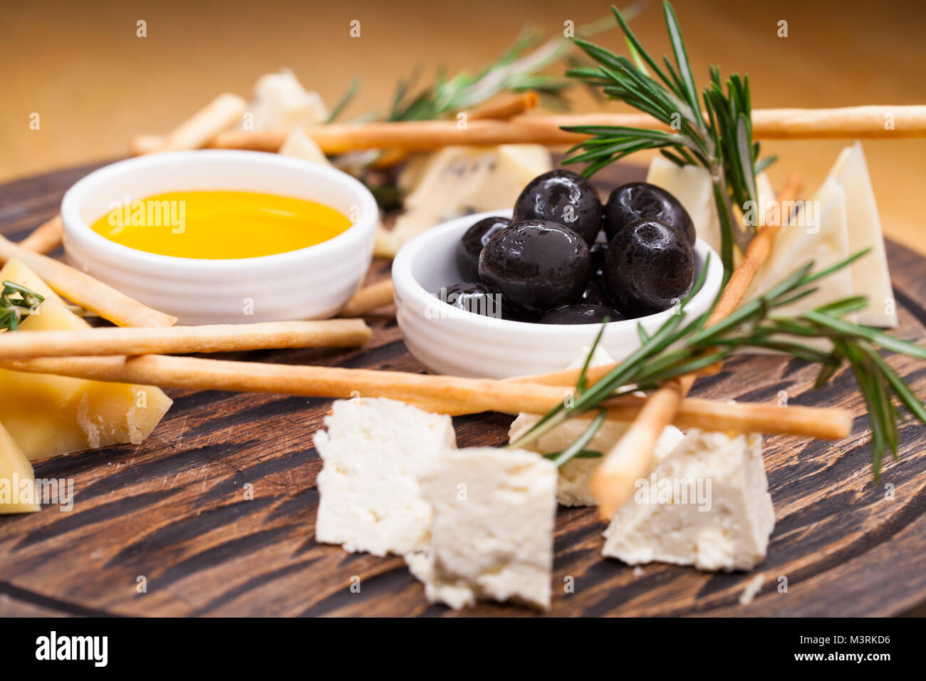 Restaurant dish - cheese sliced from different types of cheese with ...