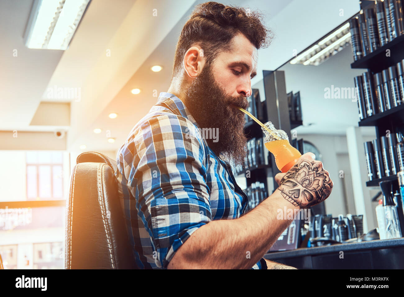 Handsome bearded man in the barbershop Stock Photo - Alamy