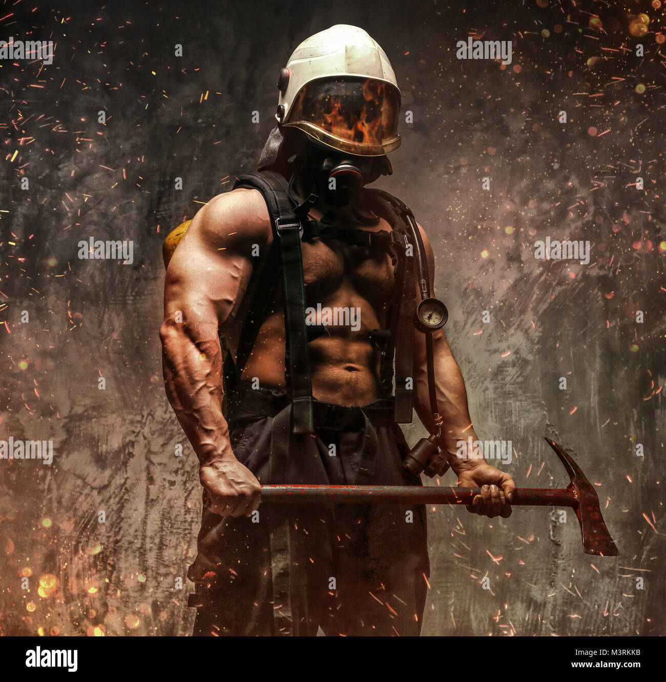 Fireman in fire sparks and smoke Stock Photo - Alamy