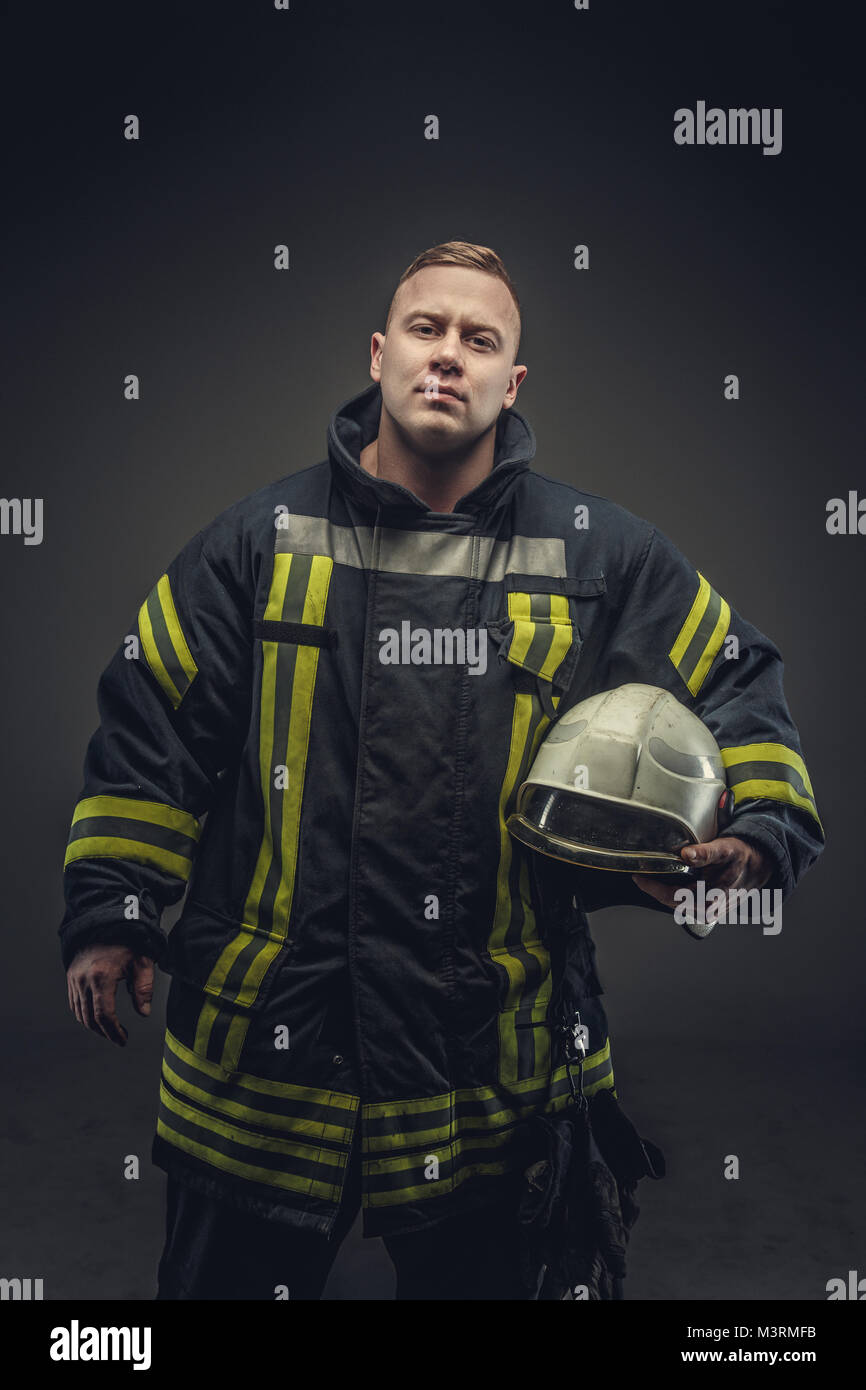 Portrait of male in firefighter costume Stock Photo - Alamy