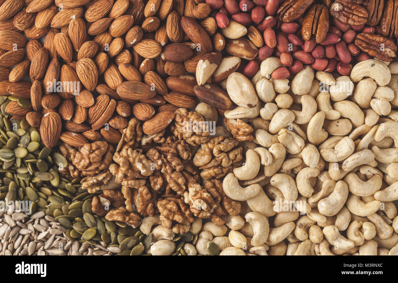 Variety of nuts background, food background, vegan health food concept ...